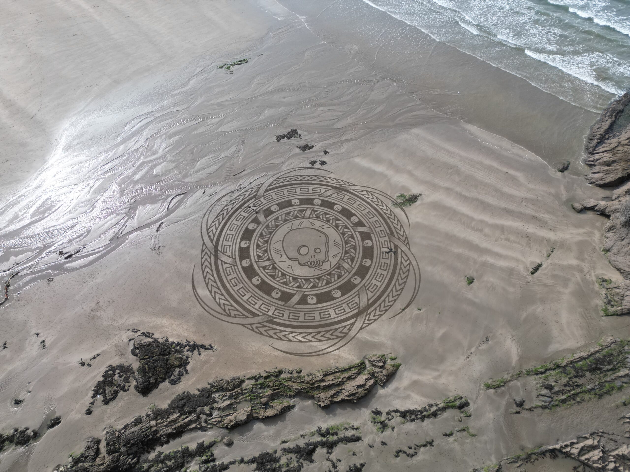 Beachgoers baffled as mysterious UFO sand patterns with hidden code ...