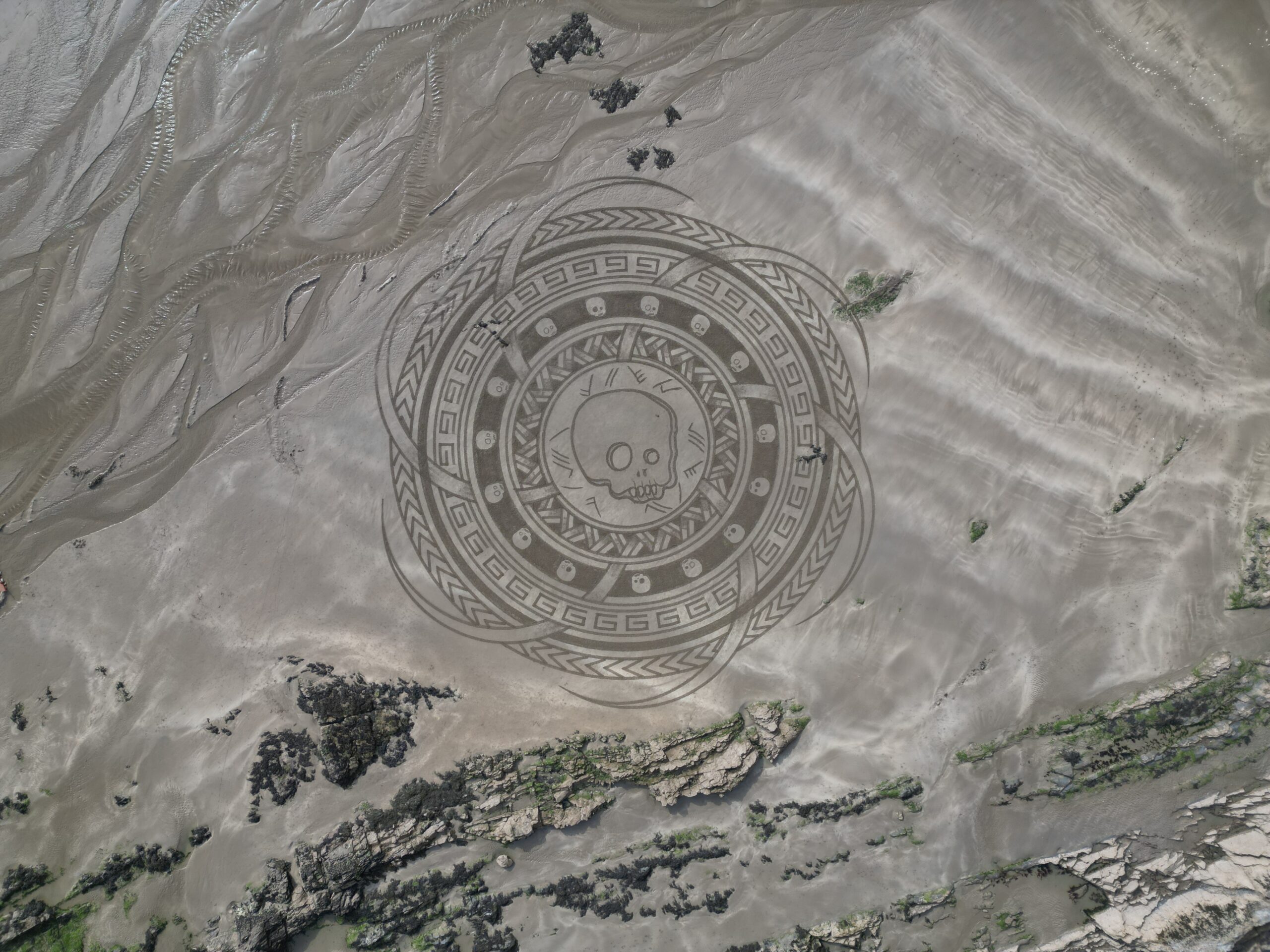 Beachgoers baffled as mysterious UFO sand patterns with hidden code ...
