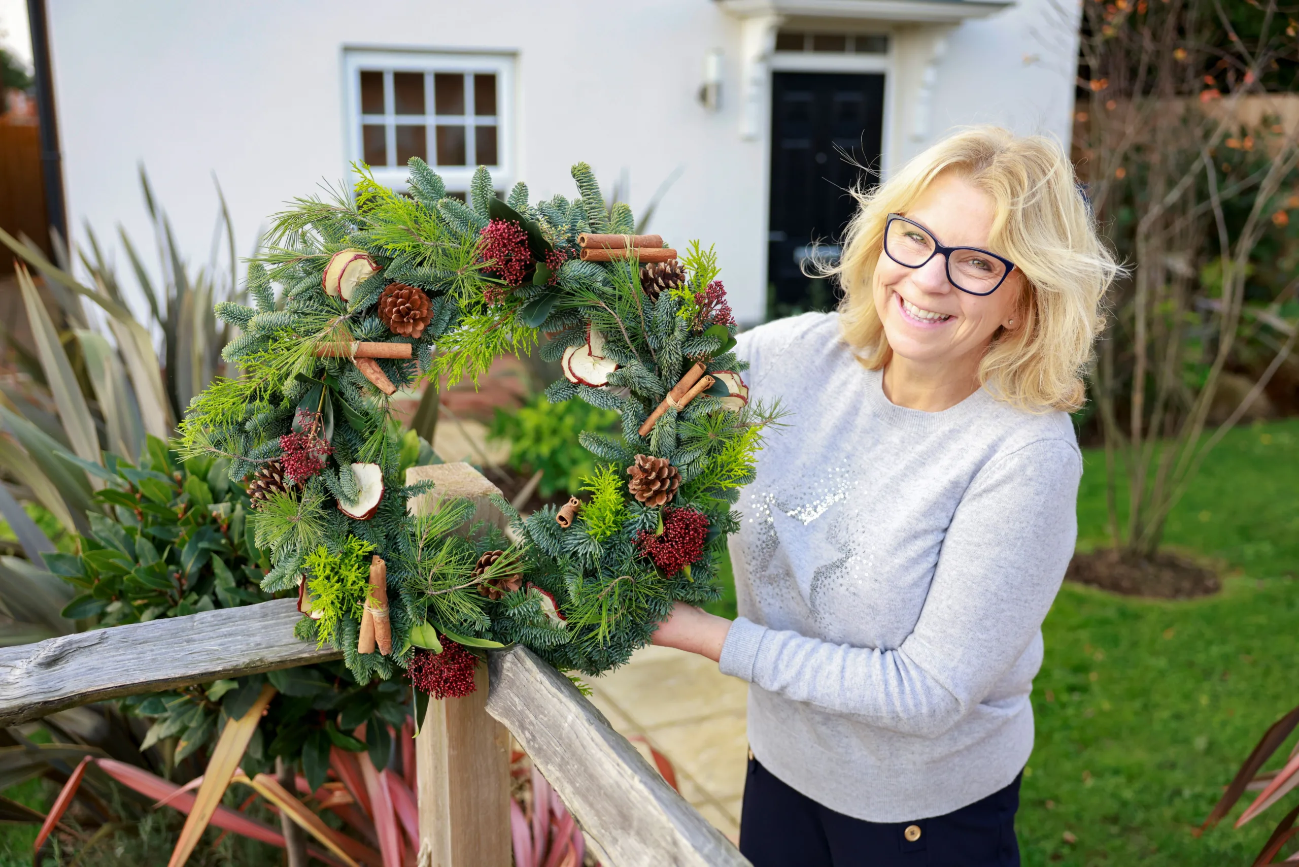 Crafting Christmas cheer: Local housebuilder hosts wreathmaking ...