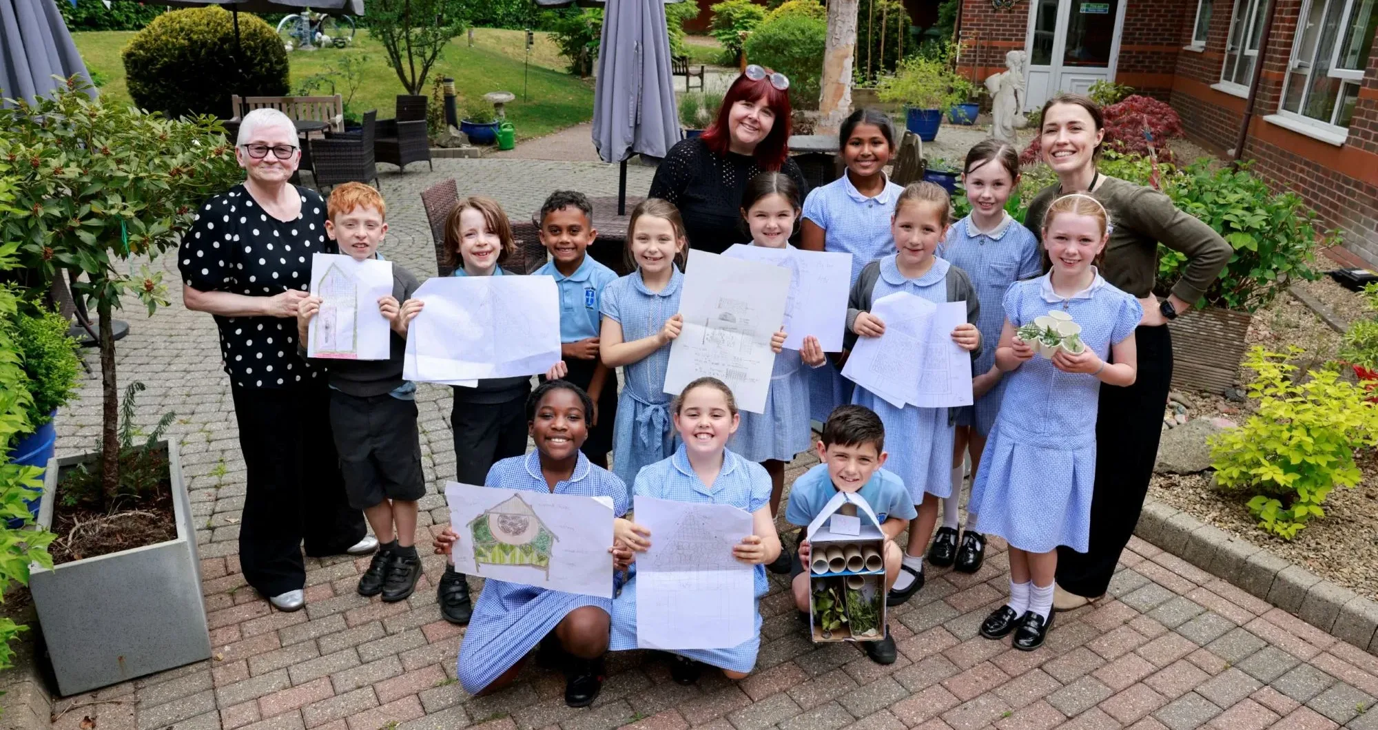 Holy Rood School pupils unveil bug hotel donated by Watford-based ...